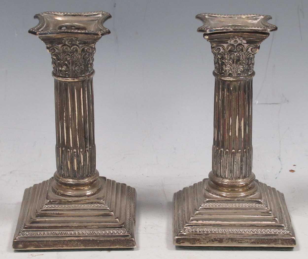 Lot 201 - Pair of small silver candlesticks