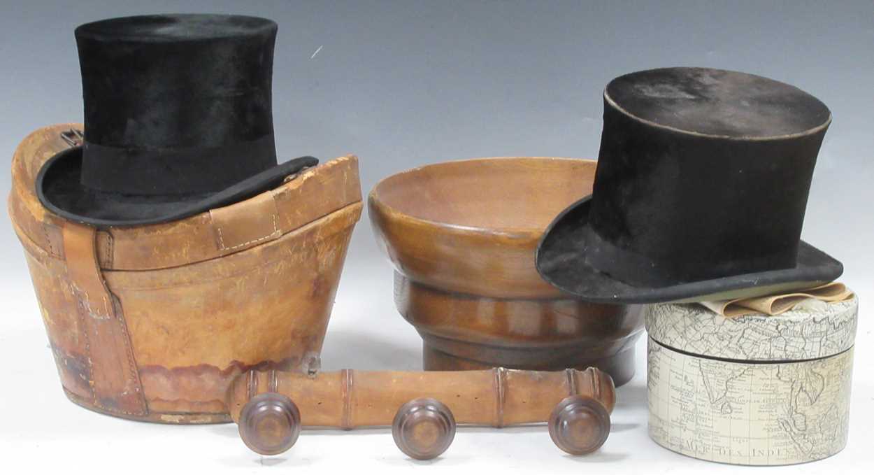 Lot 65 - Two top hats, coat hooks, stepped turned
