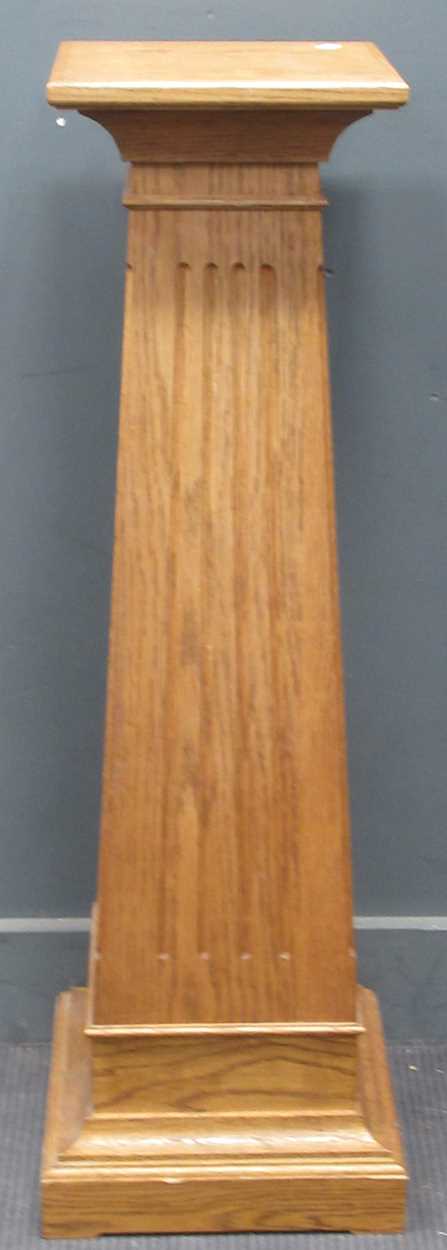 Lot 680 - An oak square section tapering plinth with