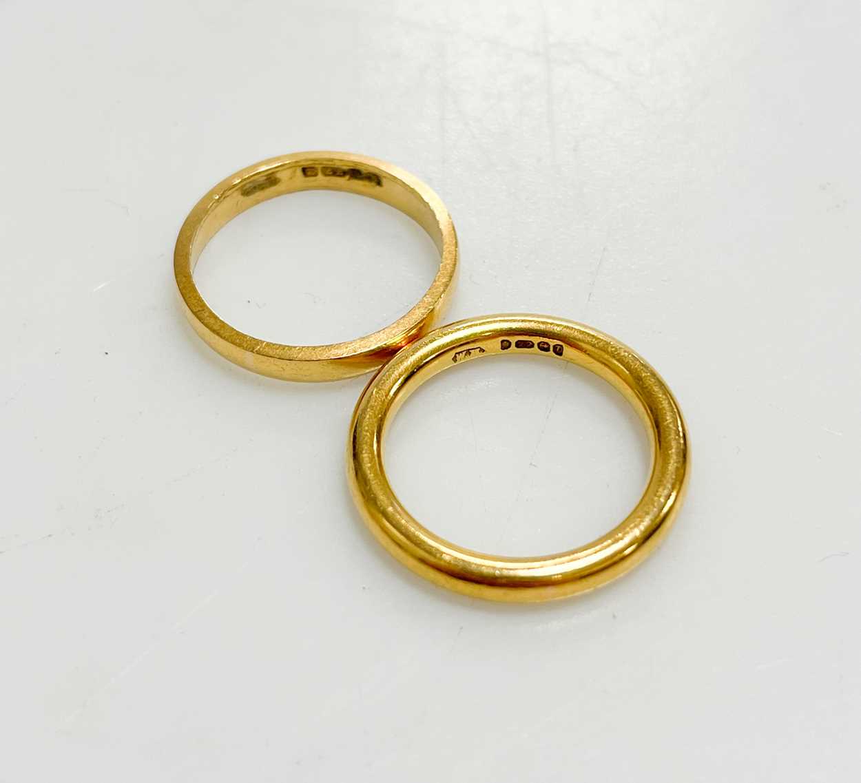 Lot 324 - Two hallmarked 22ct gold wedding rings,