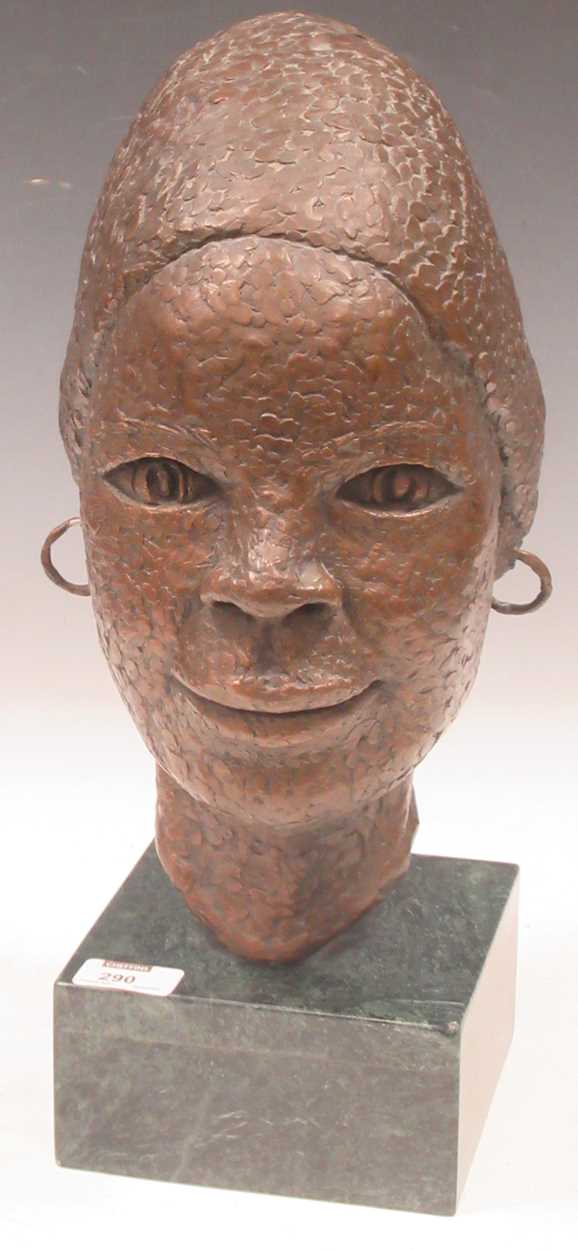 Lot 290 - A bronzed African bust on green marble stand.