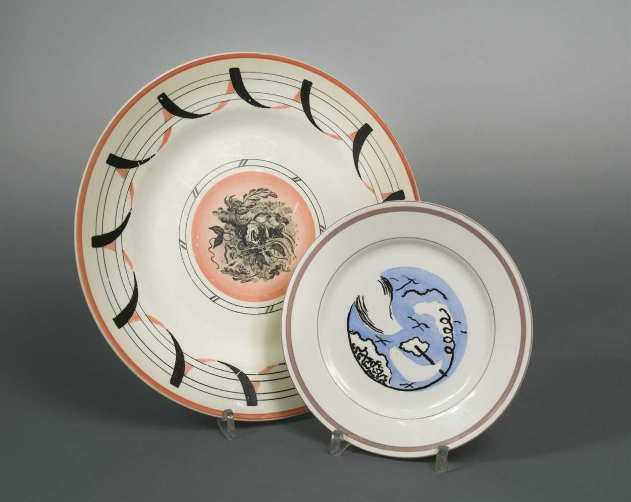 Lot 112 - Two Clarice Cliff plates designed by Graham