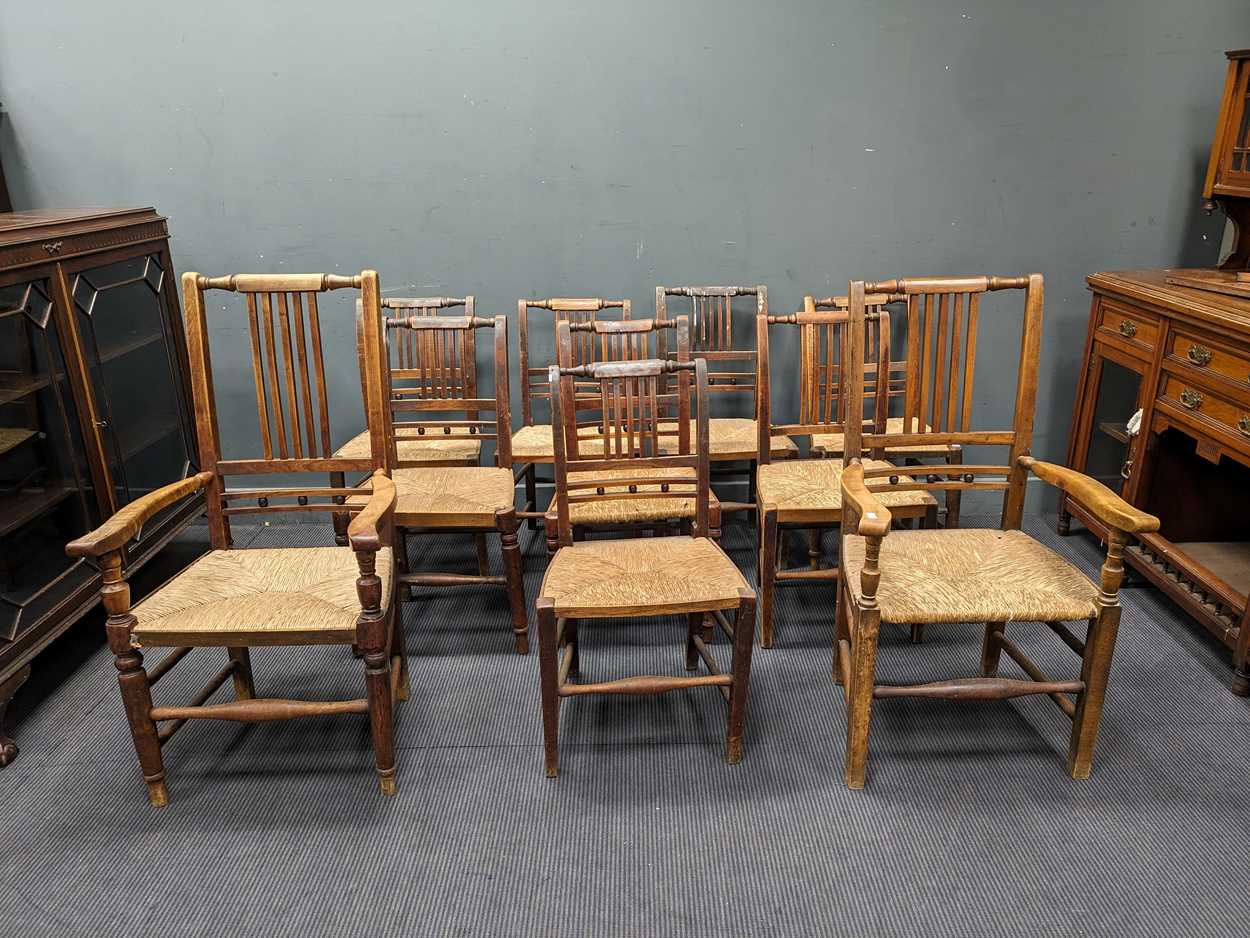 Lot 520 - Eight stained-ash chairs with rush seat,