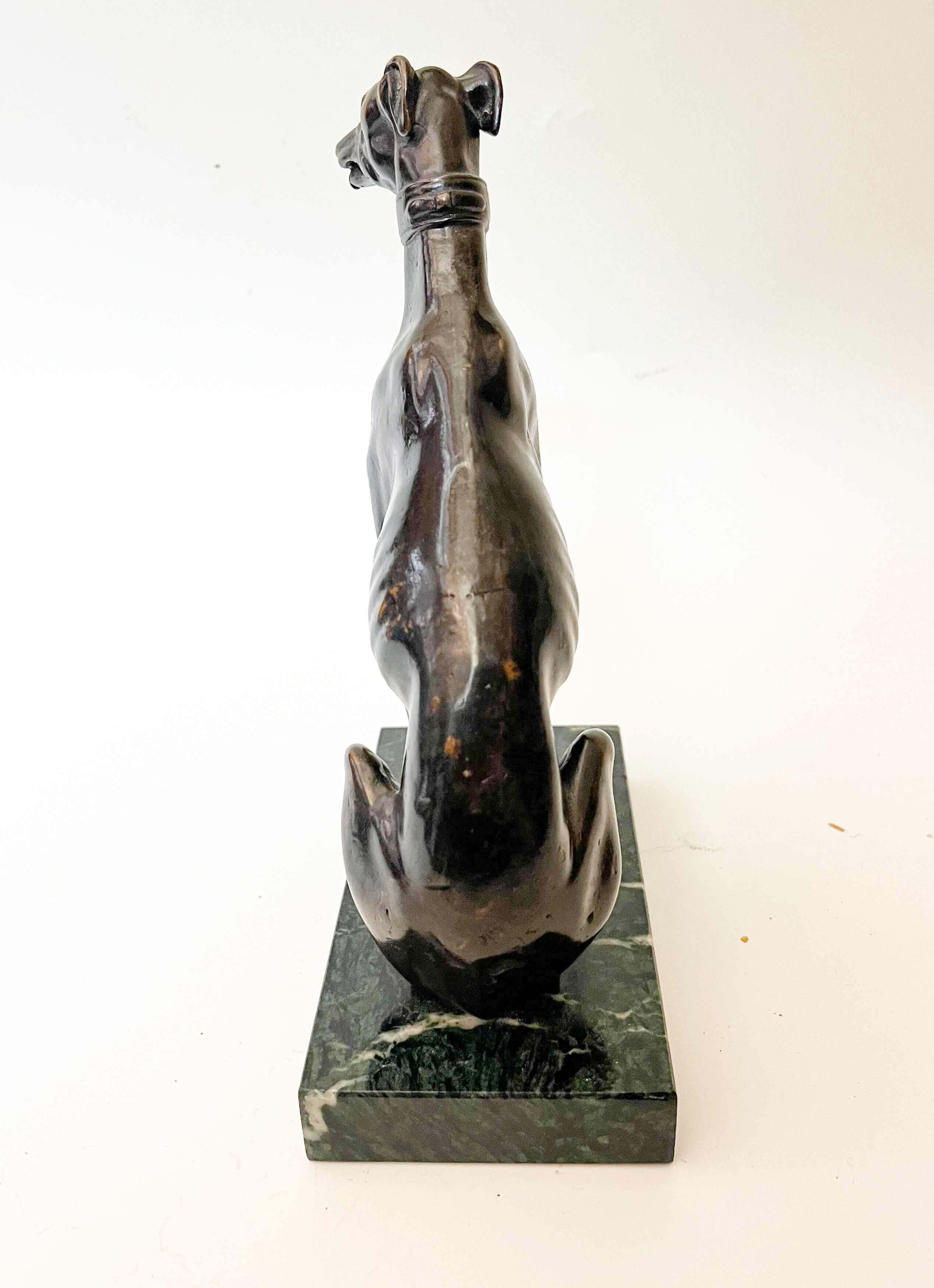 Lot 101 - A bronze model of a seated greyhound, 19th