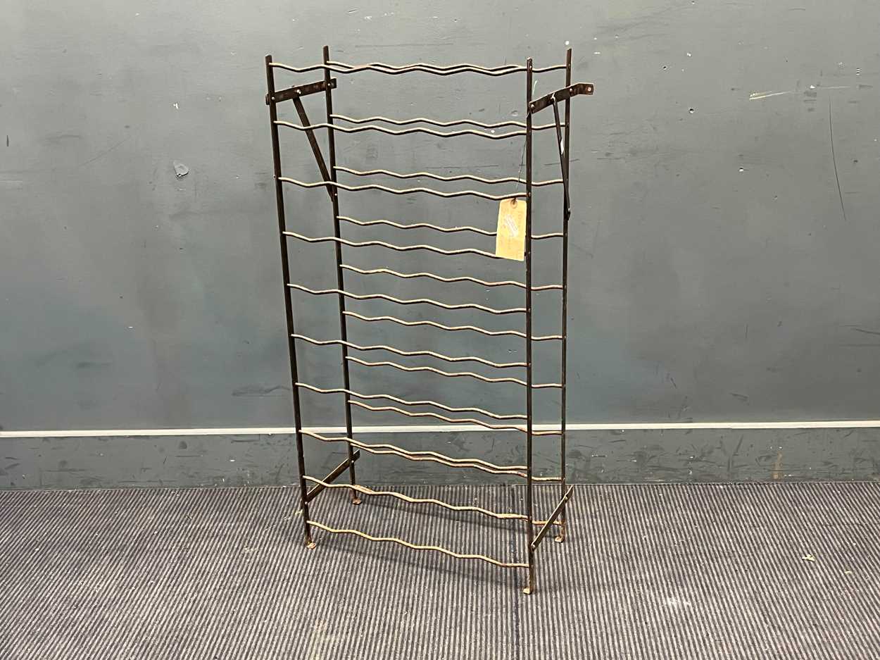 Lot 395 - A wrought iron 50 bottle wine rack, 102 x 52