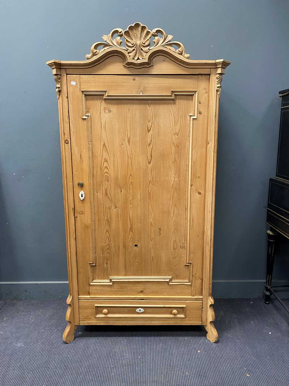Lot 345 - A French style pine cupboard, the pediment