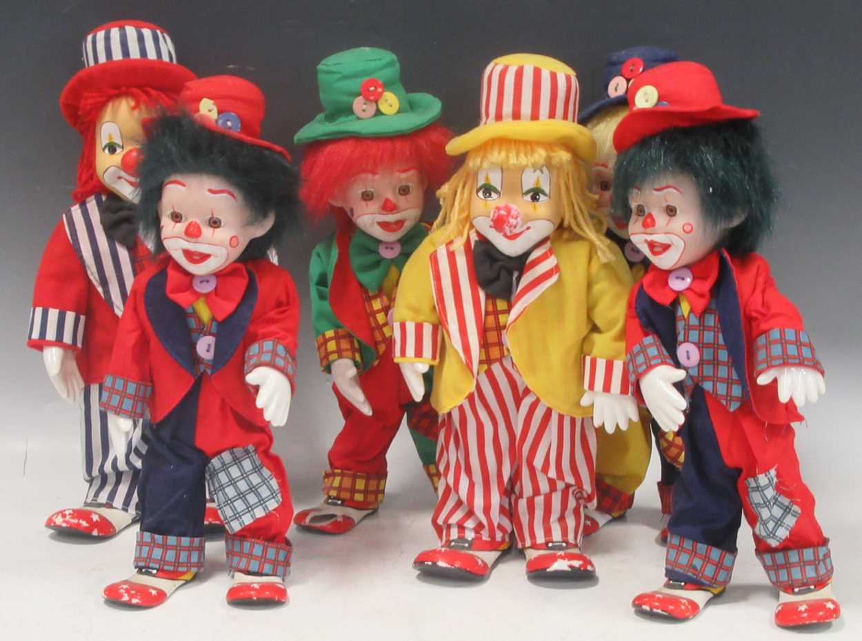 Lot 82 - A group of six clown dolls with porcelain