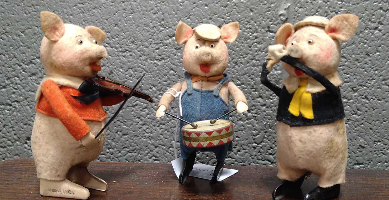 Lot 246 - A clockwork Pig Band Trio by Schuco Germany,