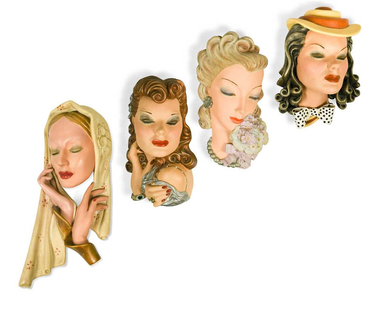 Lot 162 - A collection of Art Deco wall masks,