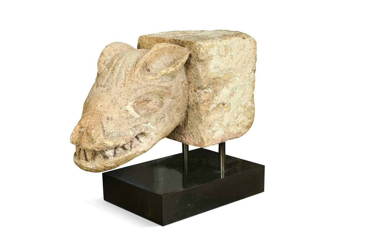 Lot 256 - A carved stone wolf head gargoyle,