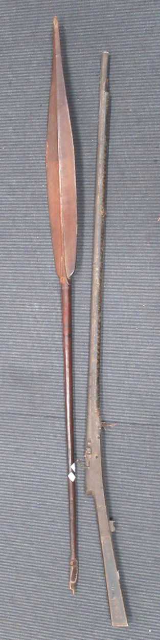Lot 268 - A Tribal ceremonial paddle, a Jezzail long