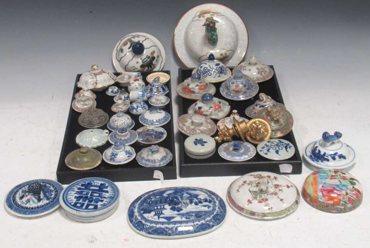 Lot 95 - A collection of Chinese covers from teapots,