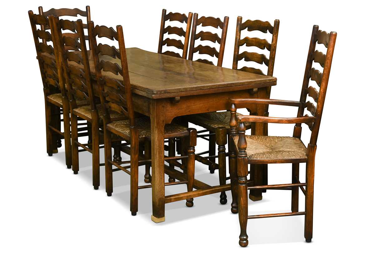Lot 393 - A set of twelve oak wavy-ladder back dining