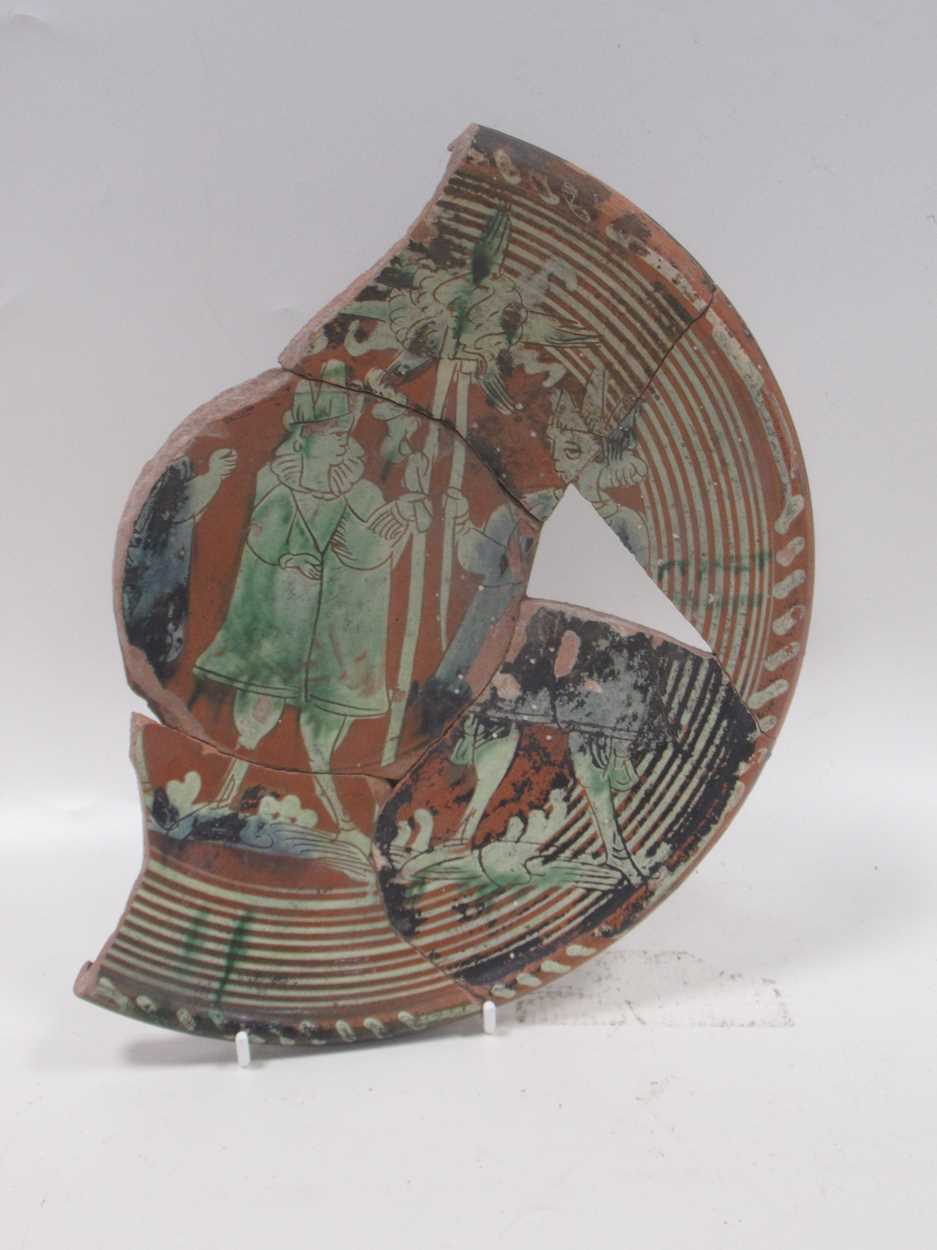 Lot 91 - A fragmentary pottery slip decorated dish,
