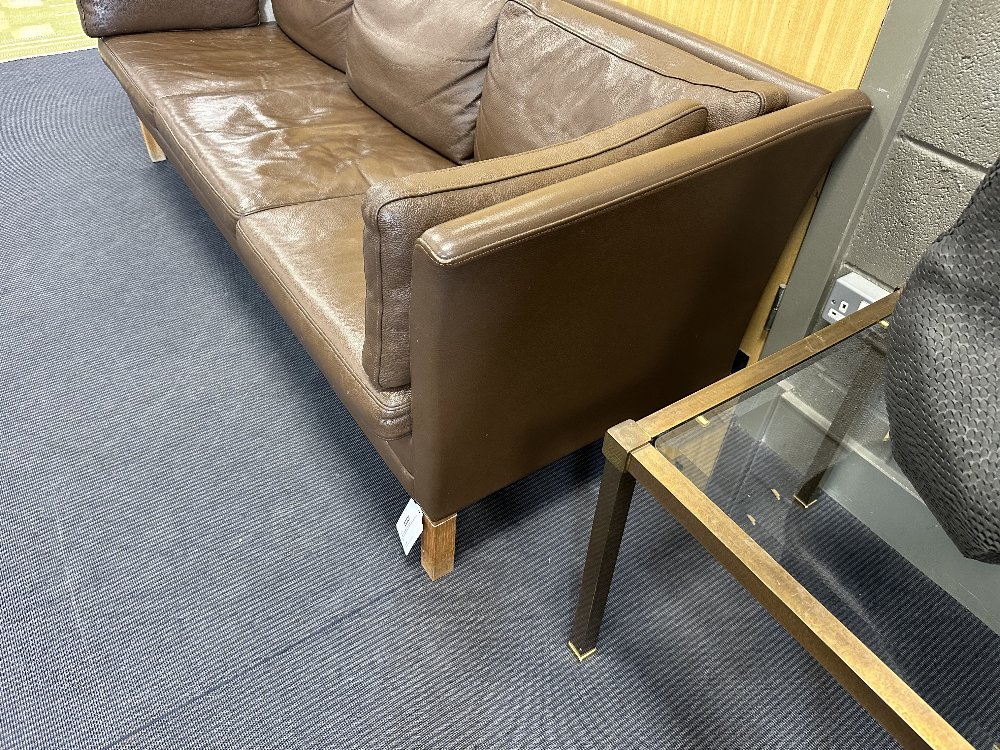 Lot 258 - A modern brown leather three-seat sofa,