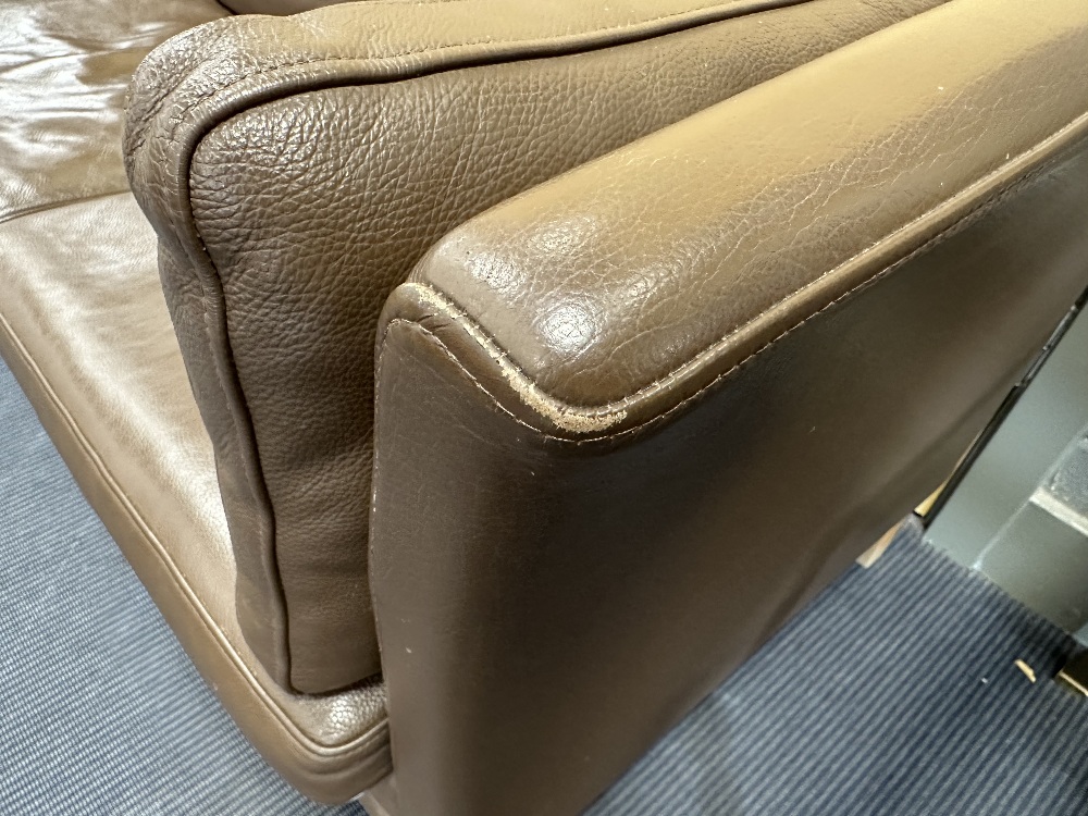 Lot 258 - A modern brown leather three-seat sofa,