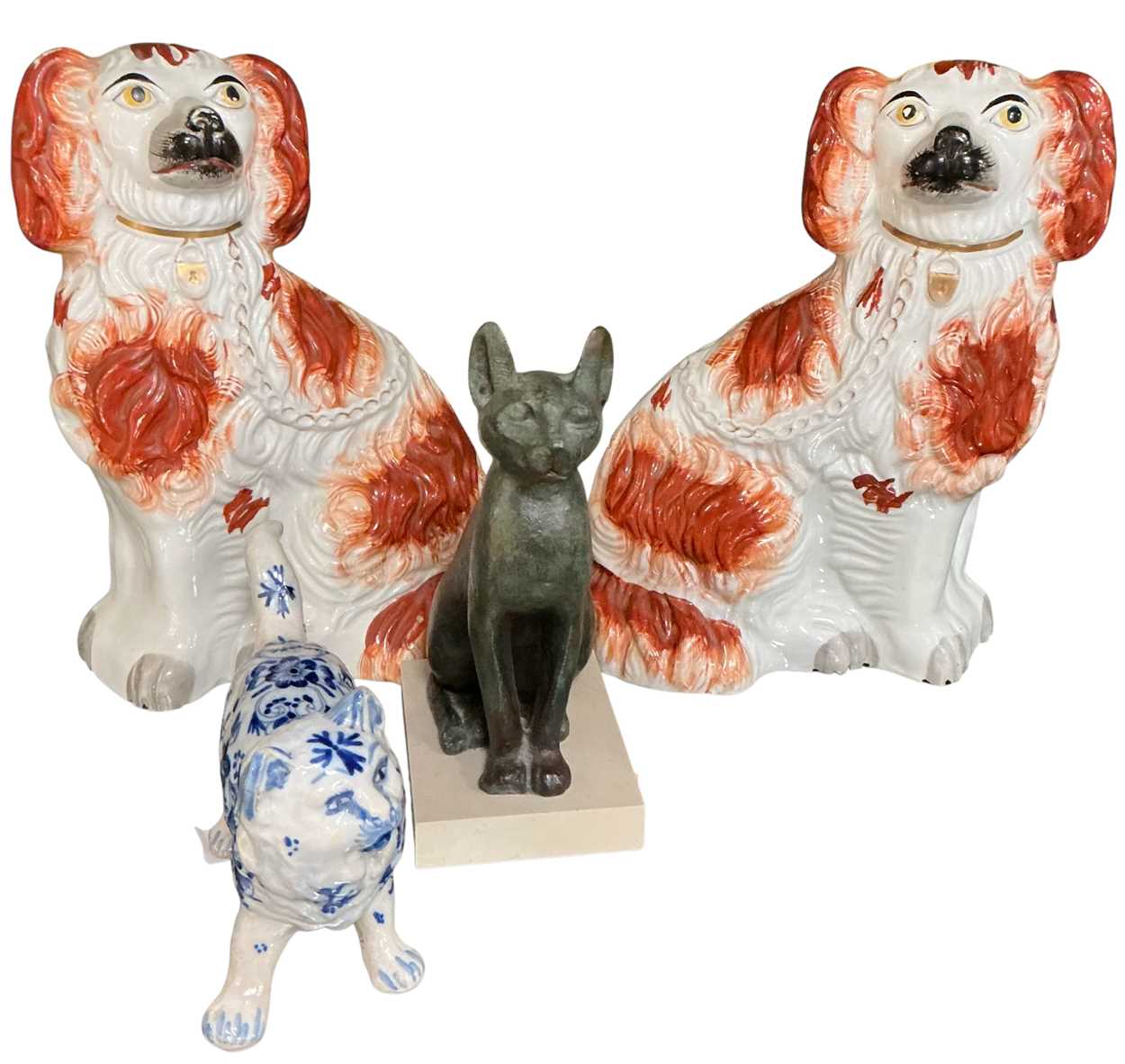 Lot 9 - A blue and white glazed pottery cat, decorated