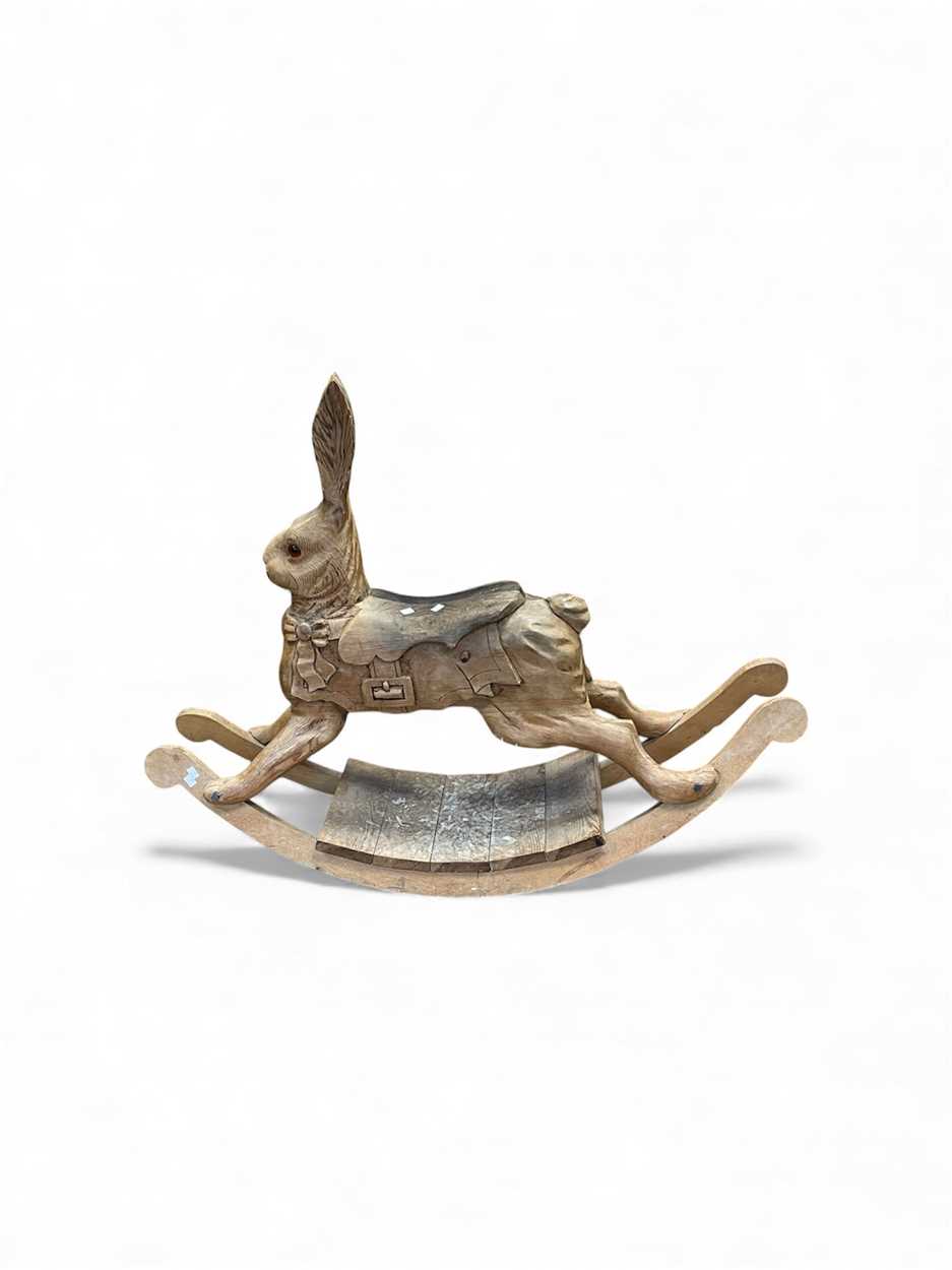 Lot 788 - A child's carved wooden rocking toy hare,