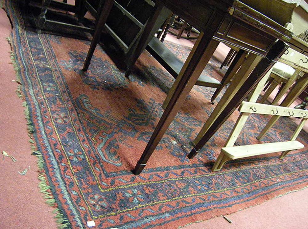 Lot 164 - Turkey rug, blue pattern on red ground