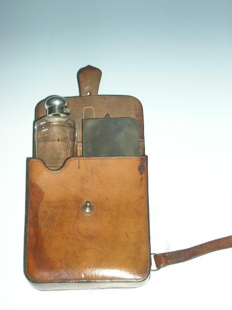 Lot 158 - An leather cased Canteen by Asprey,