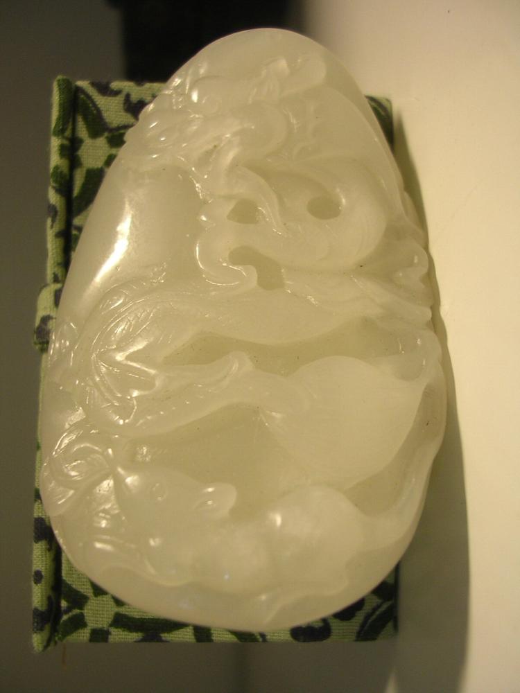 Lot 988 - A Chinese mutton fat jade pendant