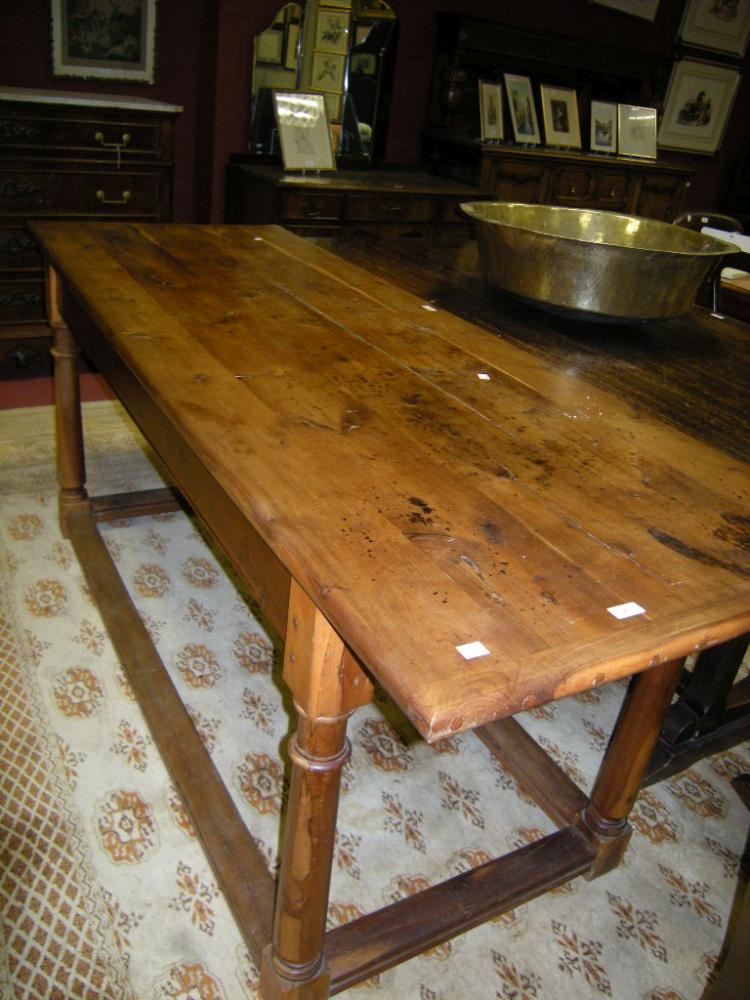 Lot 11 - A solid yew wood refectory table