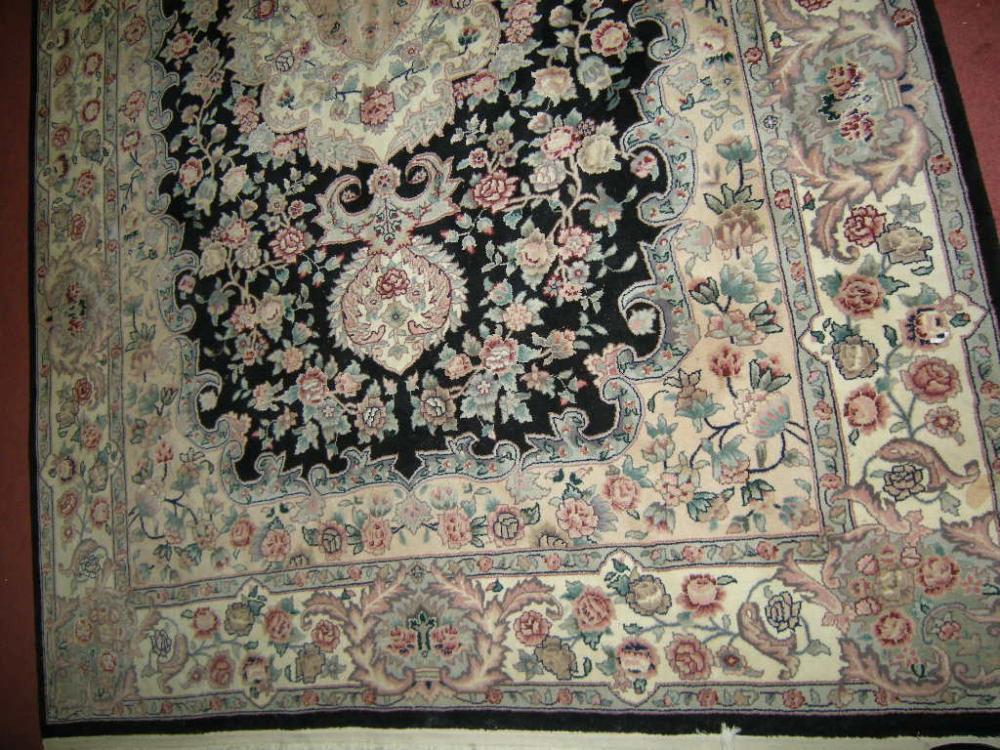 Lot 2 - An Eastern wool floral pattern rug