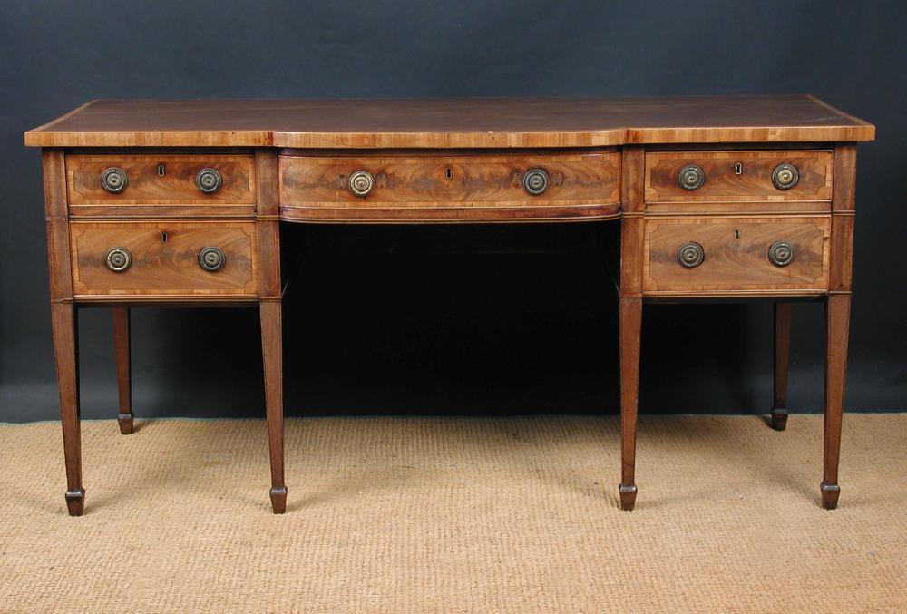 Lot 1 - A Sheraton mahogany sideboard of country house