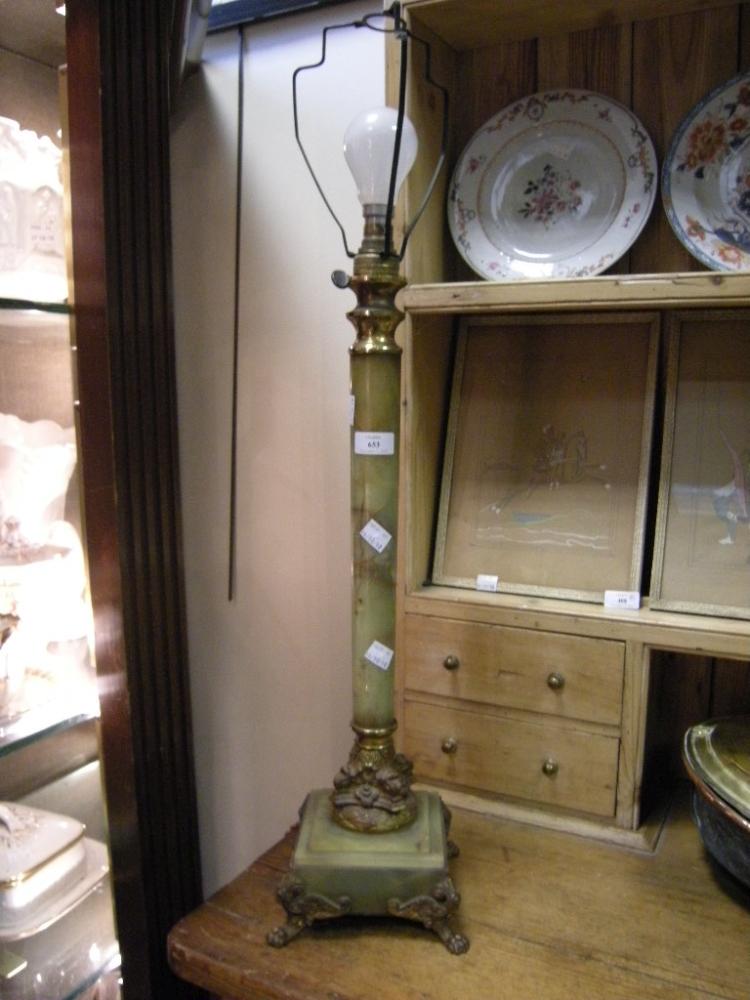 Lot 653 - An onyx and ormolu standard lamp