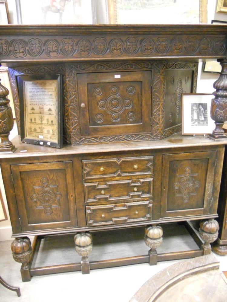 Lot 11 - An old reproduction oak court cupboard