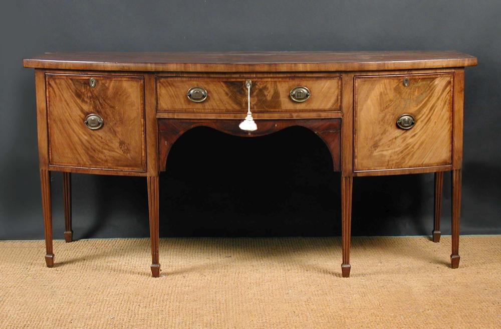 Lot 30 - A George III mahogany bow front sideboard