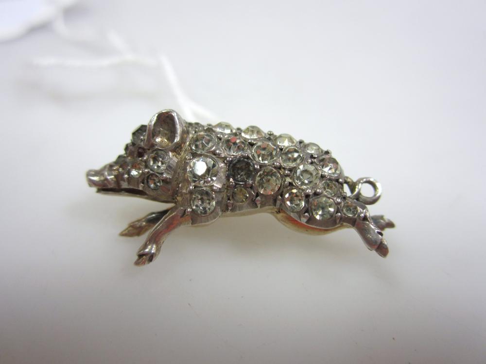 Lot 900 - A paste set galloping wild boar brooch