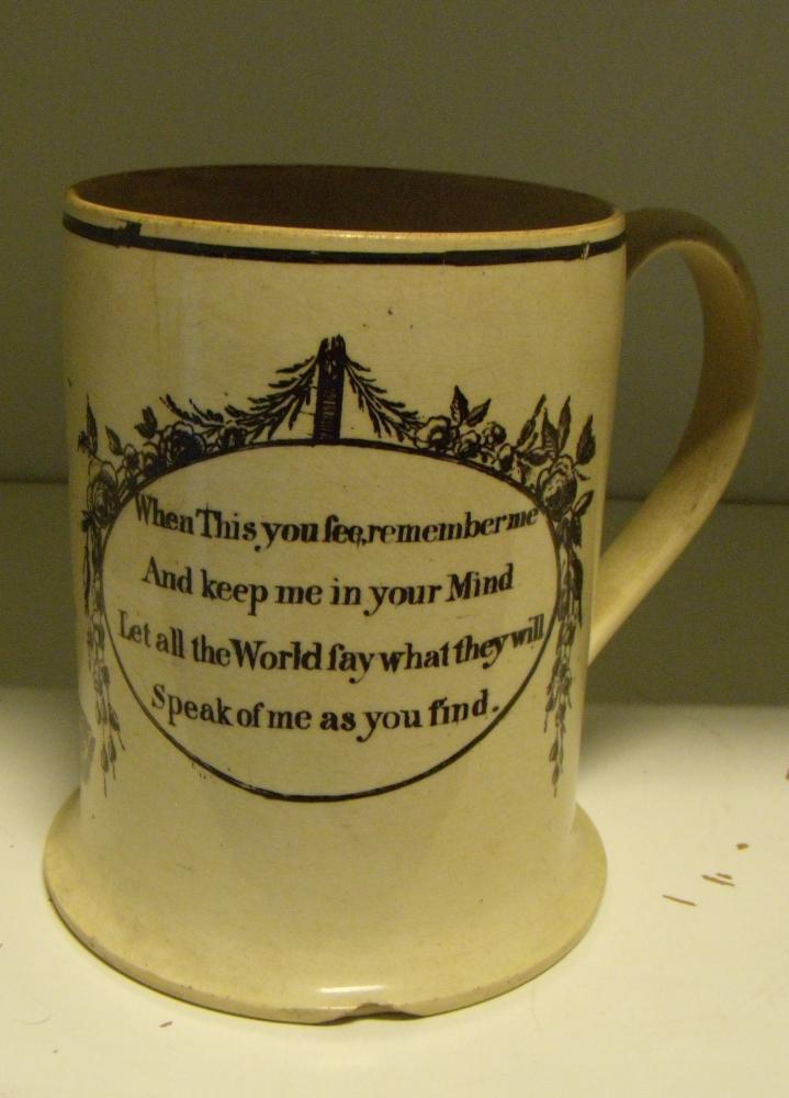 Lot 8 - A late 18th/early 19th Century creamware mug,
