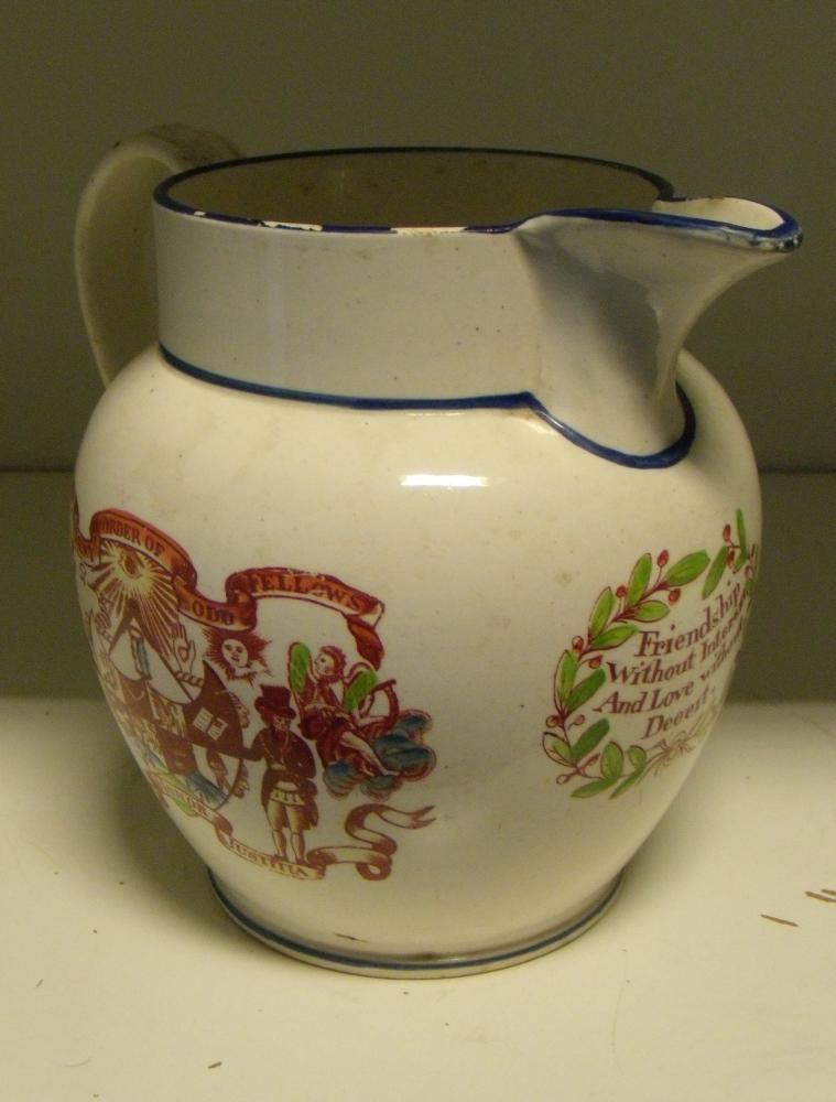Lot 9 - An early 19th century creamware jug, printed